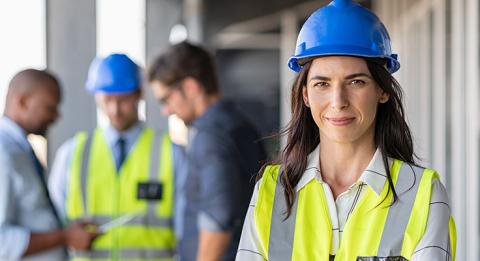 Female in blue hard hat and high vis